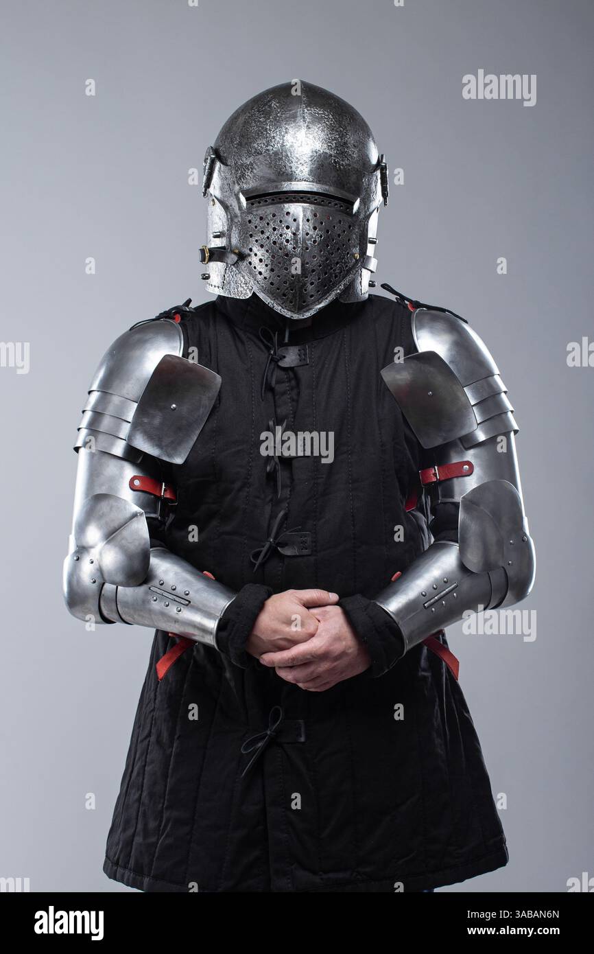 Knight in Full Plate Armor. This image shows a person fully clad in ...