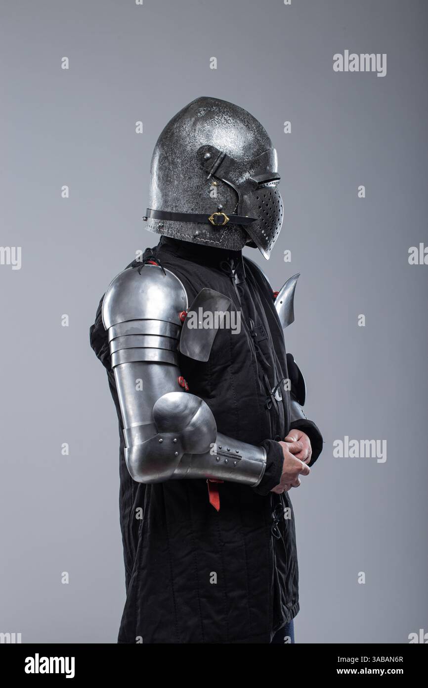 Knight in Full Plate Armor. This image shows a person fully clad in ...