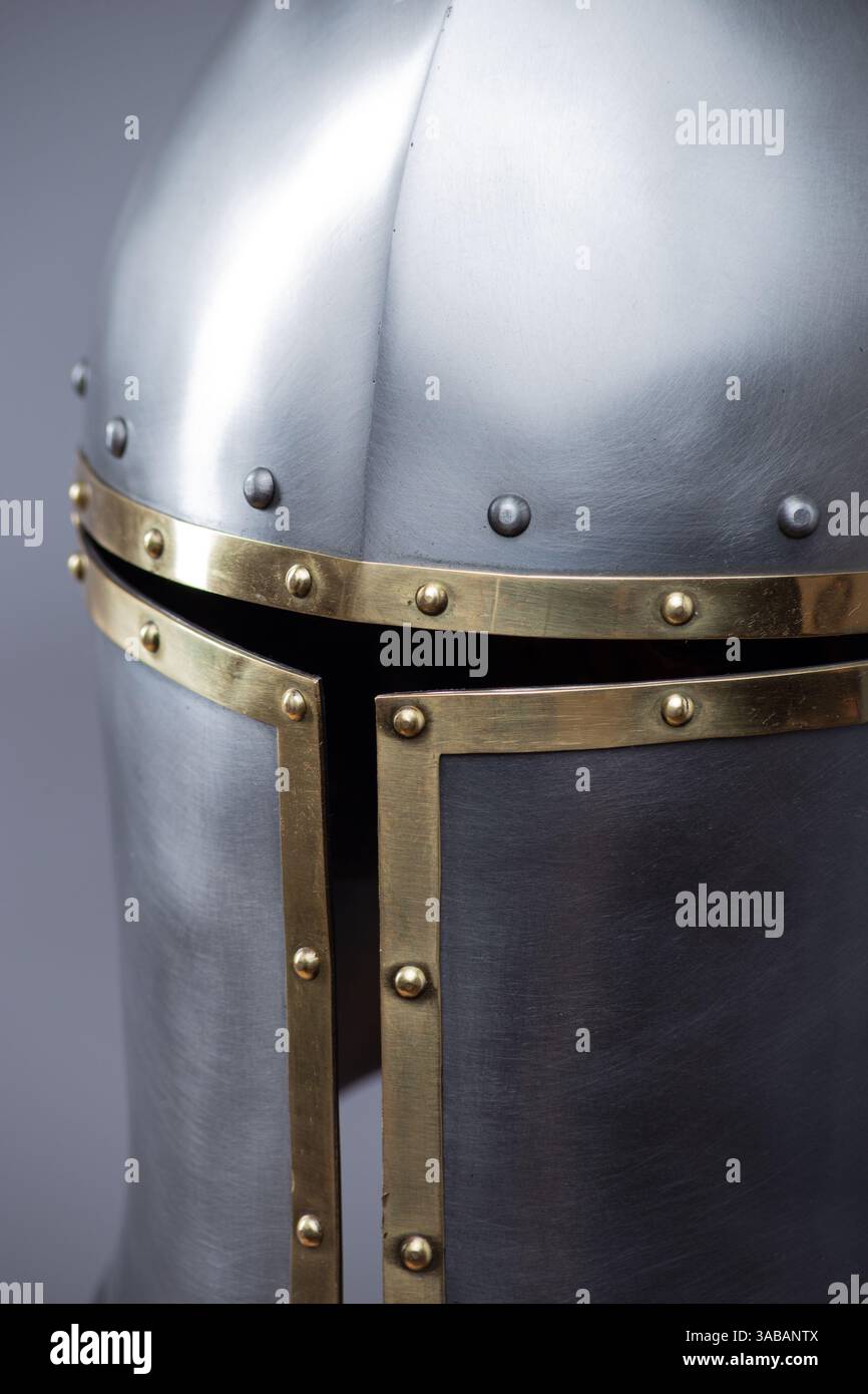 Silver Medieval Barbute Helmet with Brass Trim. This image shows a ...