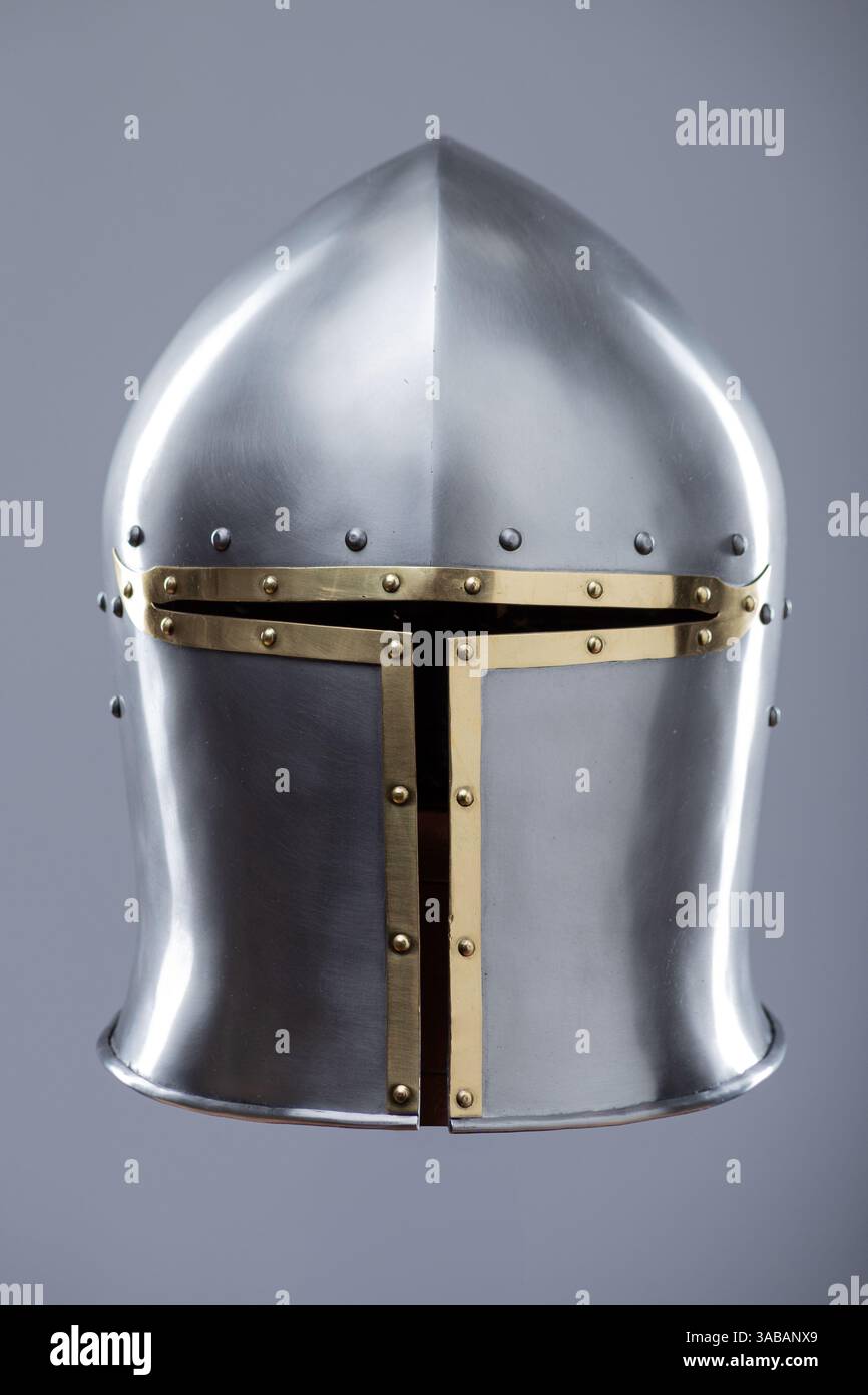 Silver Medieval Barbute Helmet with Brass Trim. This image shows a ...