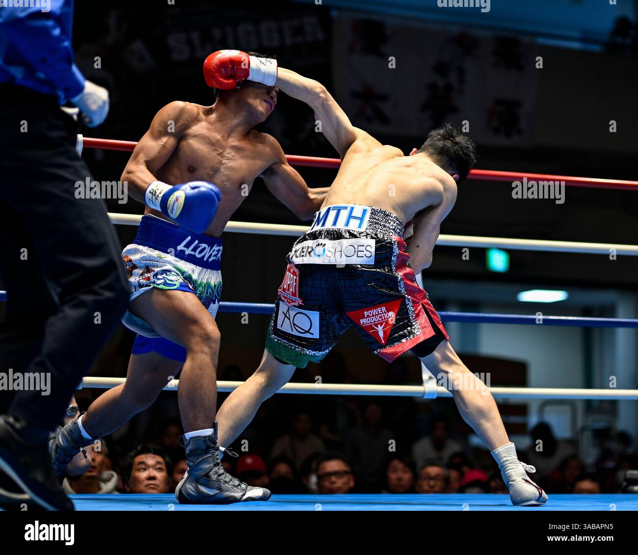 Challenger Philippines' Kenneth Llover (blue gloves) knocks down ...