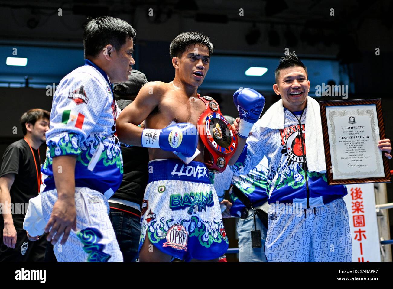 Philippines' Kenneth Llover, center, celebrates after winning the OPBF ...