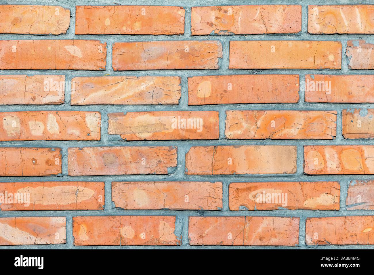 A stunning display of rustic orange bricks forms a unique wall ...