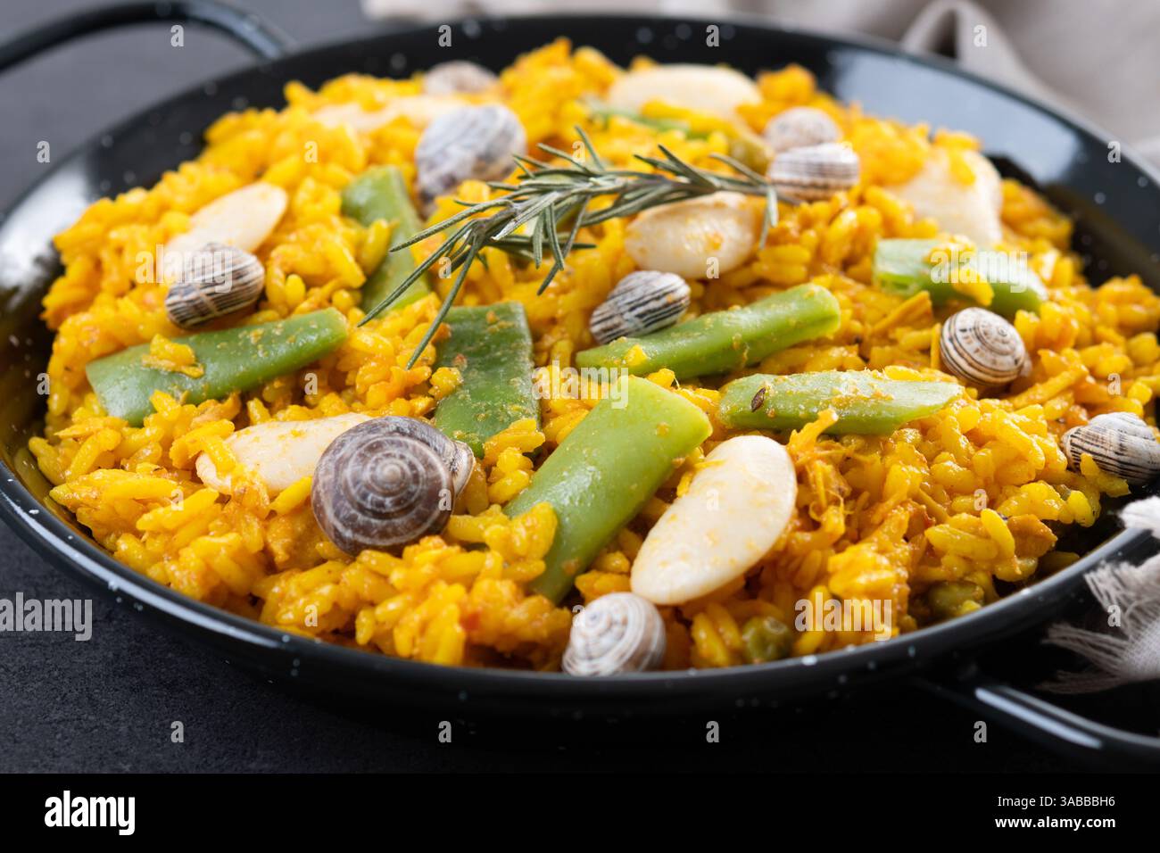 Traditional Valencian paella with rabbit, chicken, garrofon beans ...