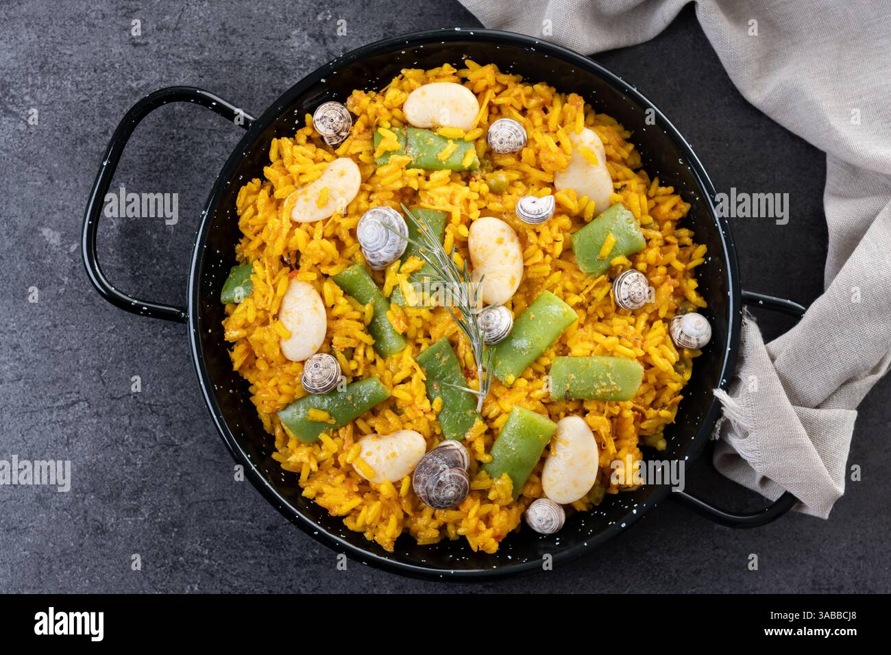 Traditional Valencian paella with rabbit, chicken, garrofon beans ...