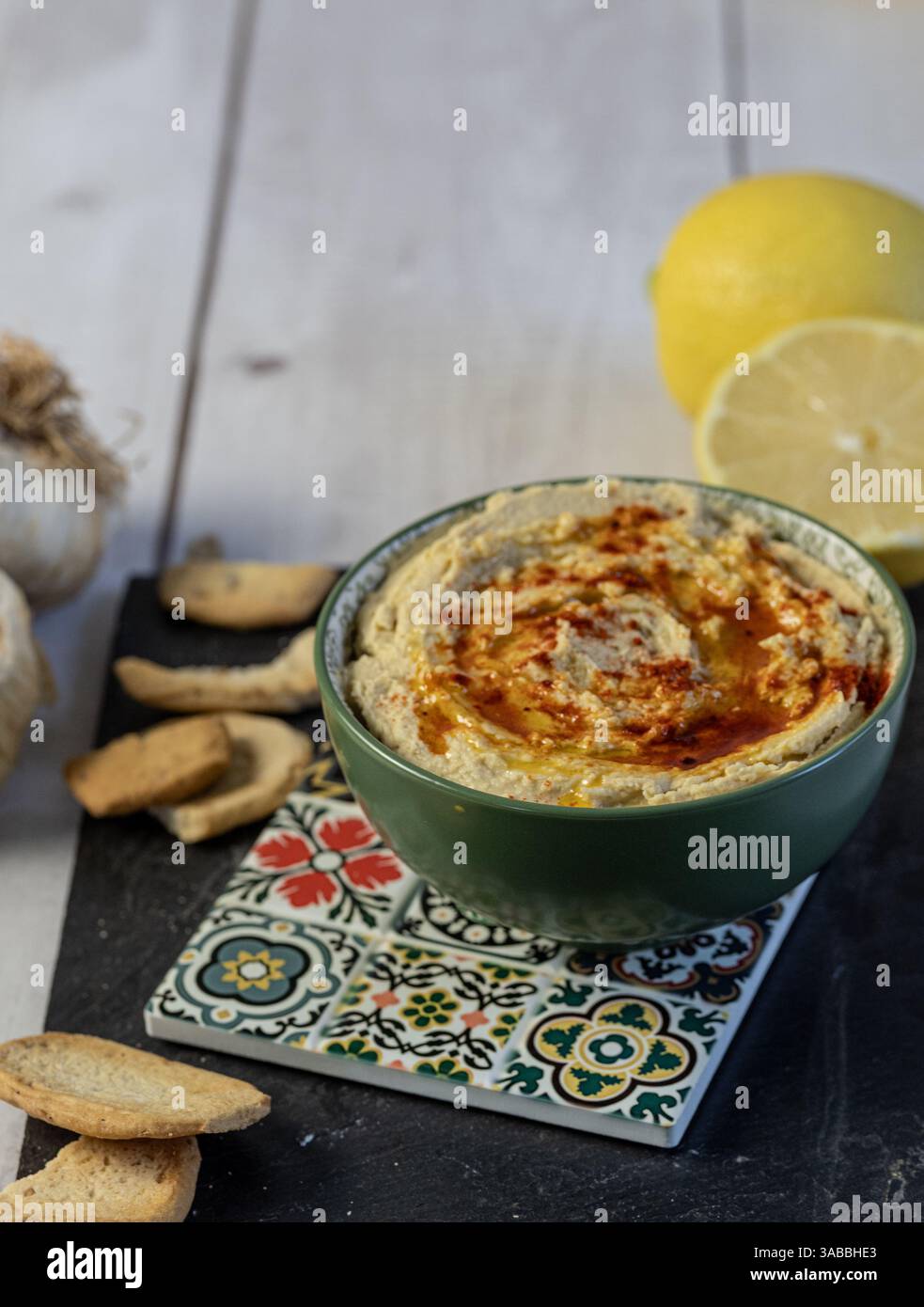 Beautiful bowl of hummus, traditional Middle Eastern vegetarian dish ...