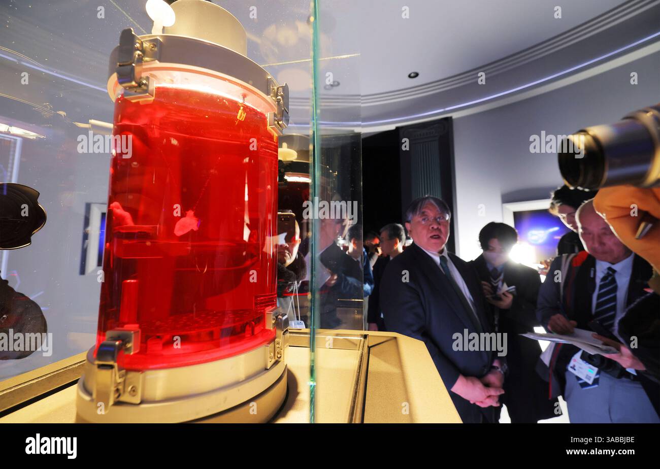 A photo shows the "iPS heart" developed by Yoshiki Sawa (R) at Pasona Natureverse at Yumeshima ...