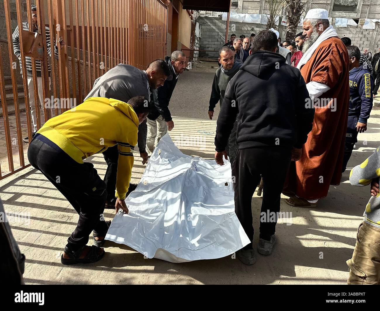 Palestinians mourn over the bodies of Abu Qaoud family killed in ...