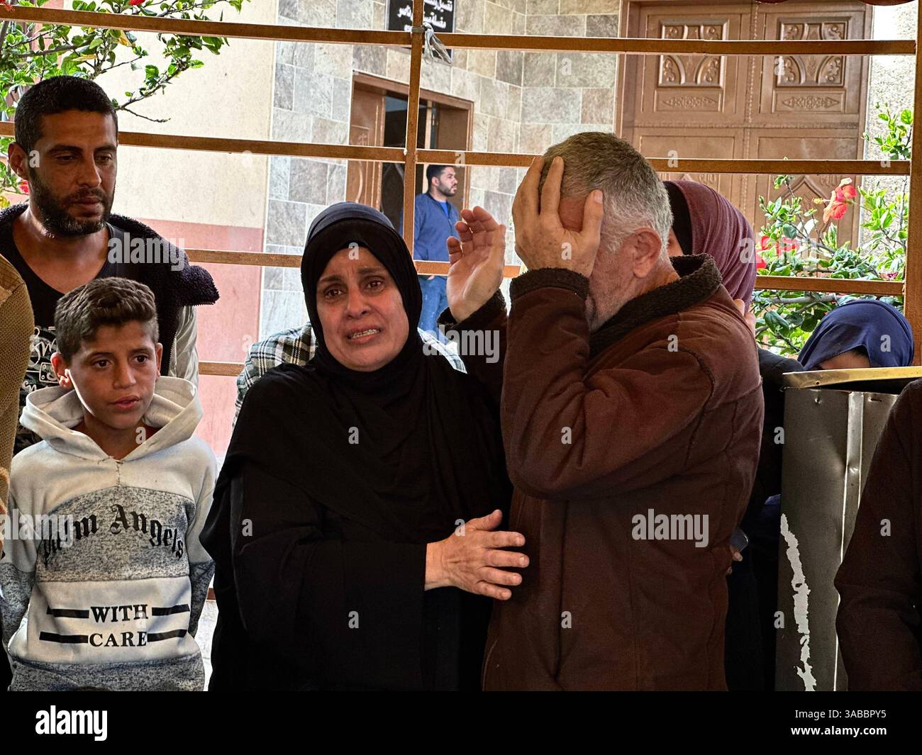 Palestinians mourn over the bodies of Abu Qaoud family killed in ...