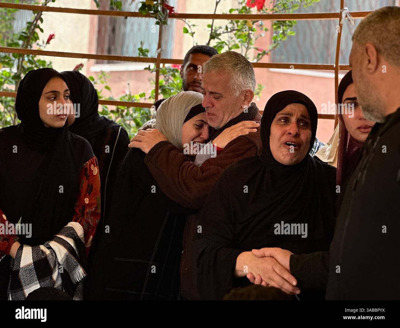 Palestinians mourn over the bodies of Abu Qaoud family killed in ...
