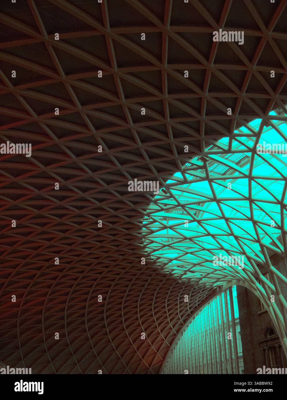 Detail of white steel lattice roof in London's King's Cross railway ...