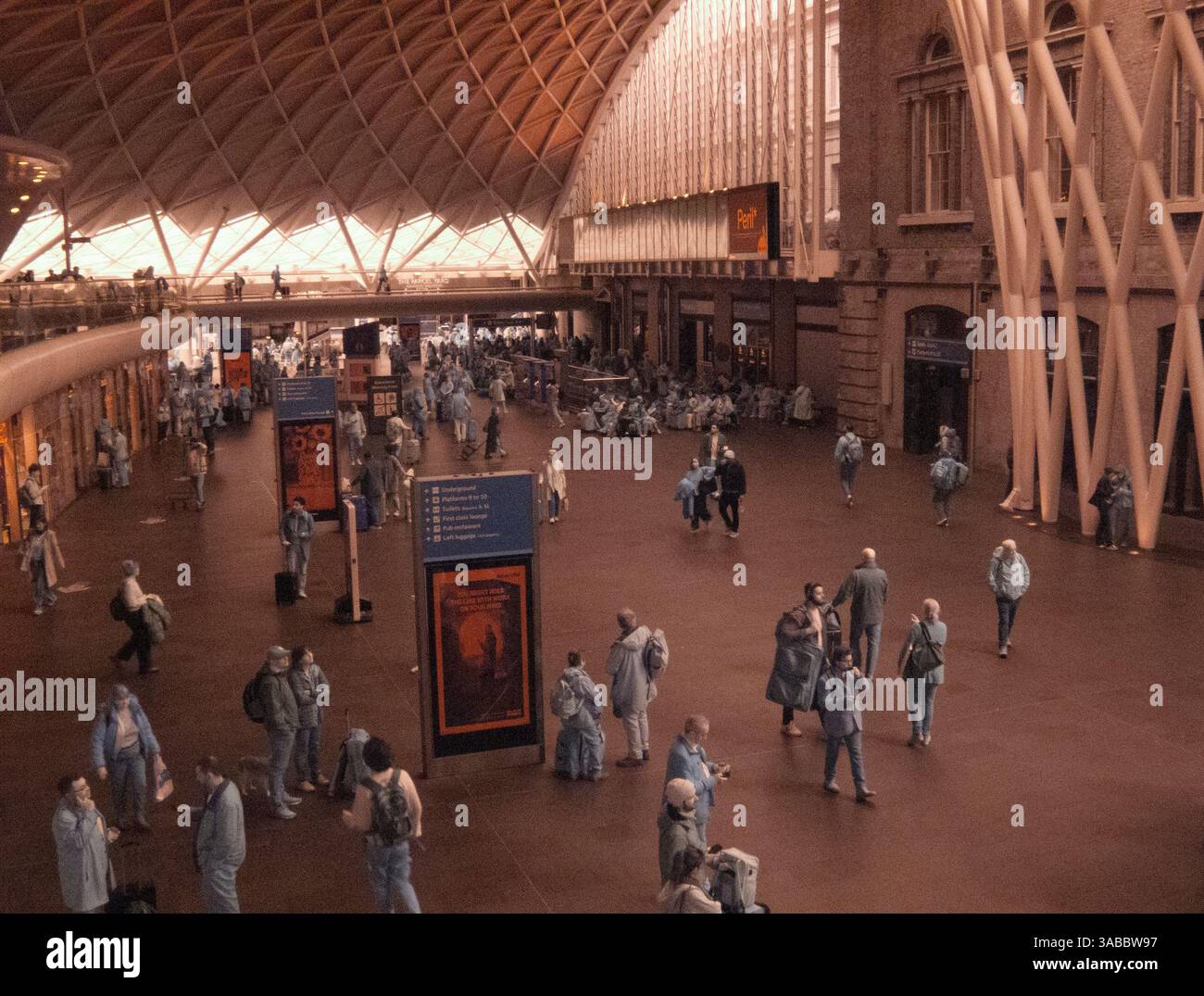 Interior of King's Cross train station with lattice steel roof and ...