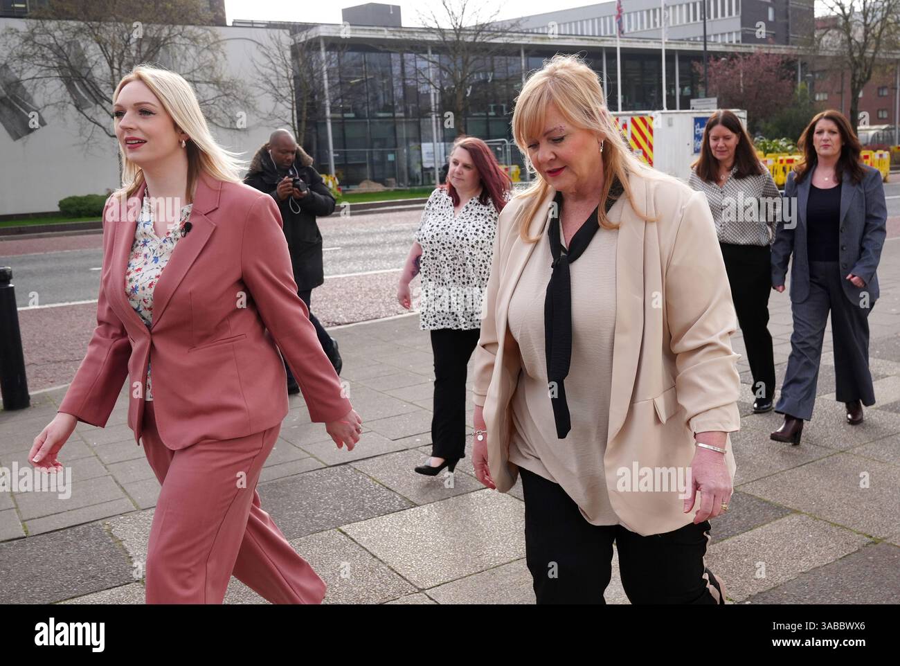 Bethany Hutchison (left) and Lisa Lockey (right) lead a group of nurses ...