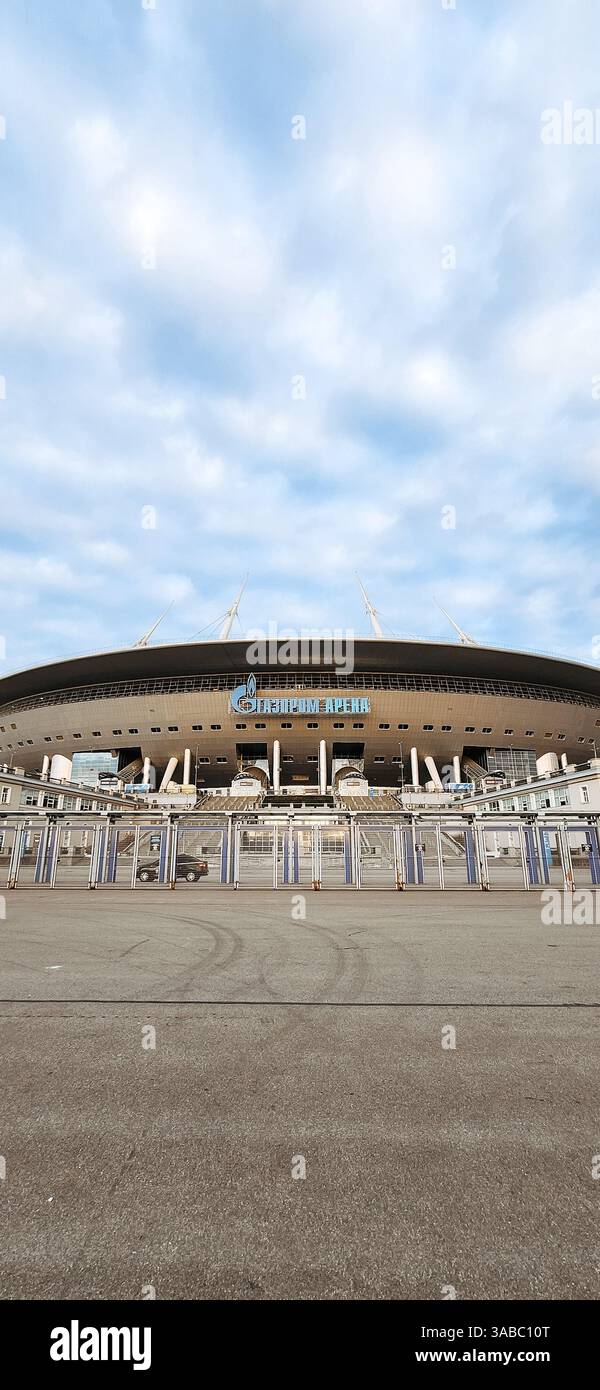 View of a modern stadium with unique design elements under a partially ...