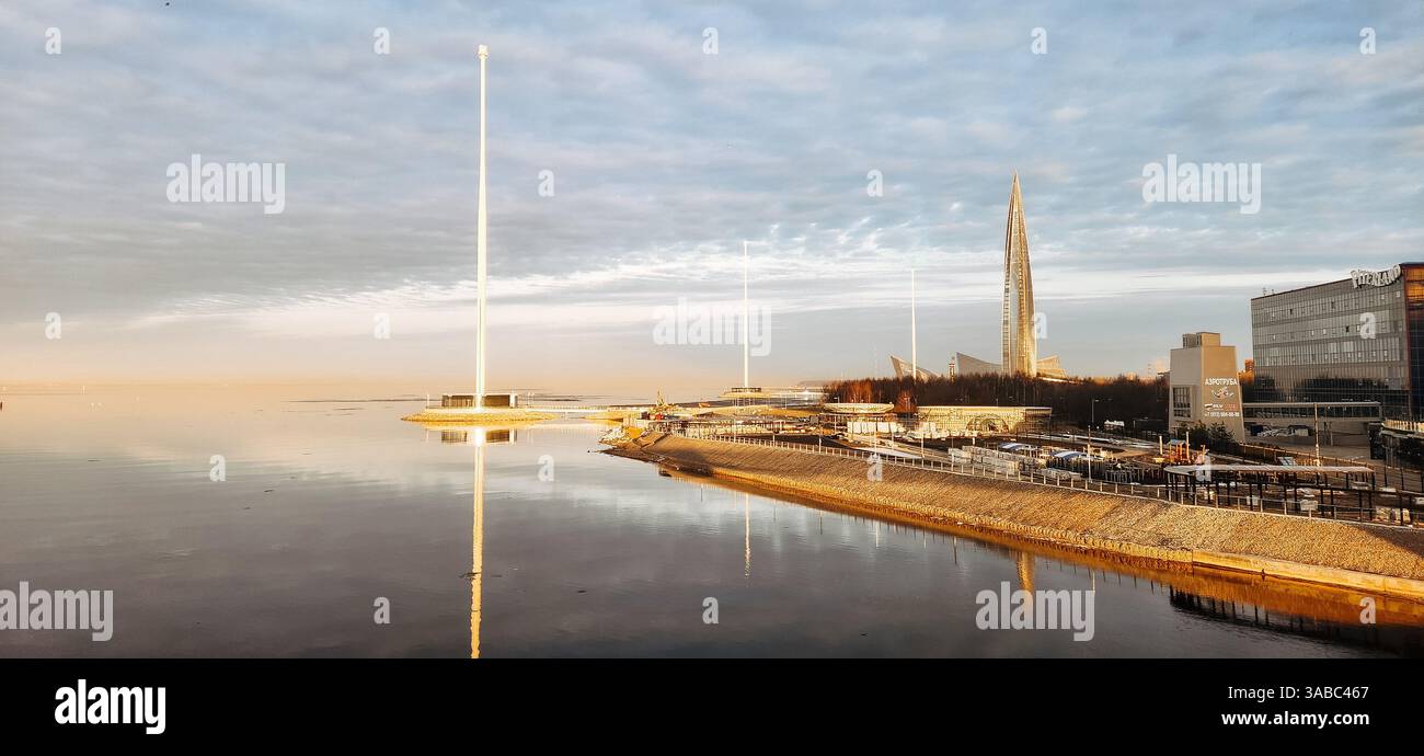 empty promenade leads to a modern skyscraper, framed by a cloudy sky ...