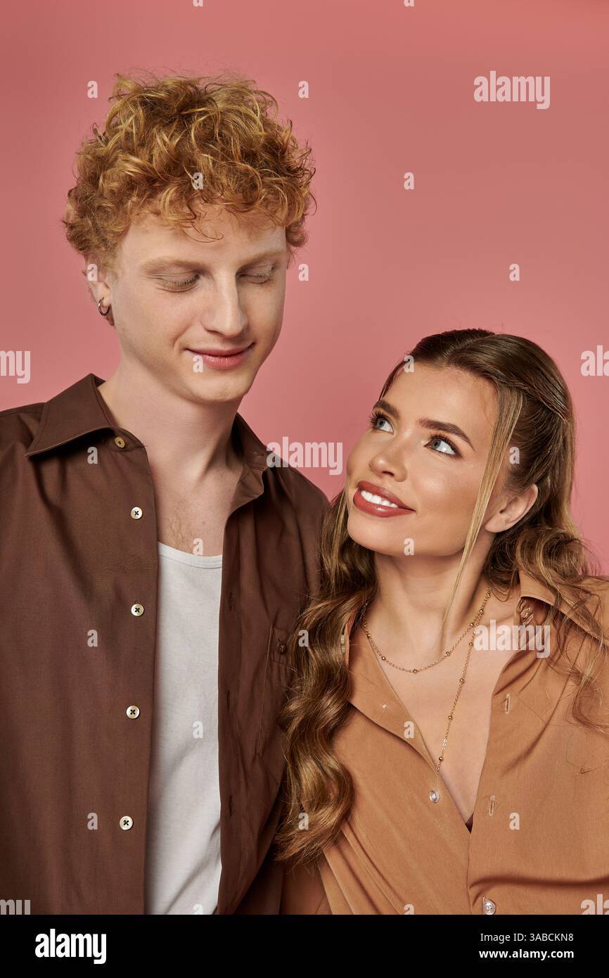 A stylish couple shares a tender moment, showcasing their love and ...