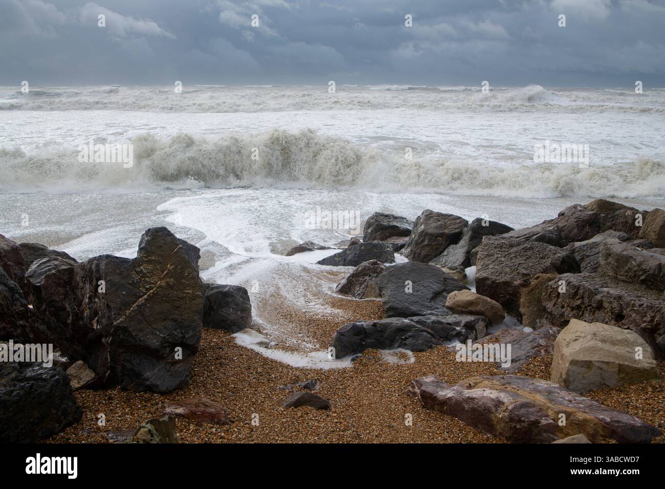Barton on Sea beach. Rough sea on a windy day with sun and clouds Stock ...