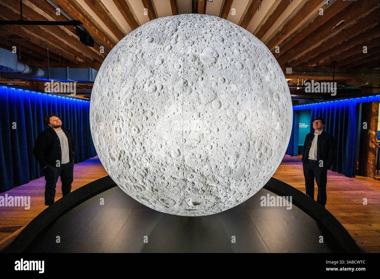 London, UK. 2 Apr 2025. The Moon by artist Luke Jerram, at the opening of London Museum Dockland ...
