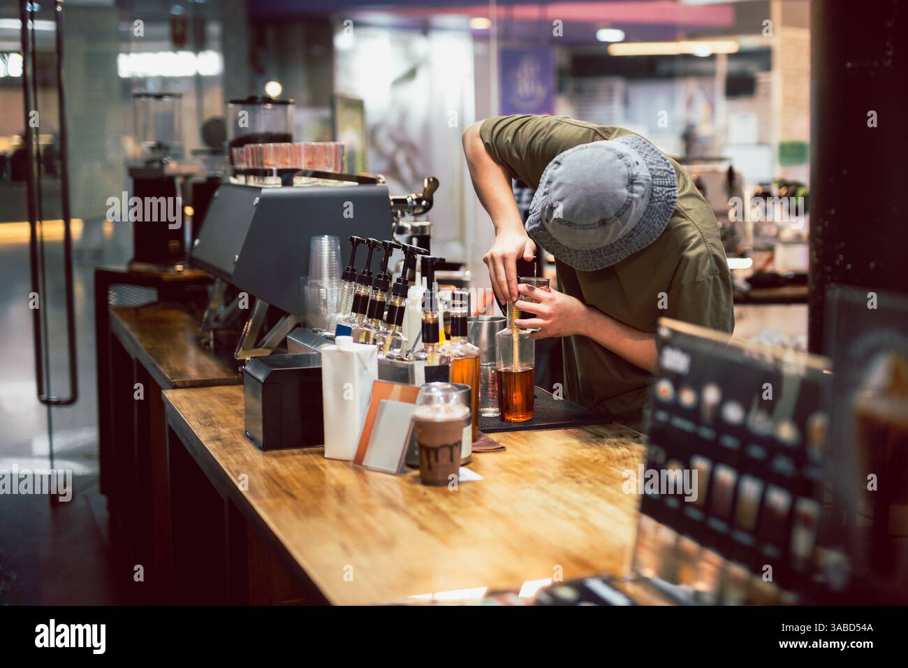 Male barista holding tamper hi-res stock photography and images - Alamy