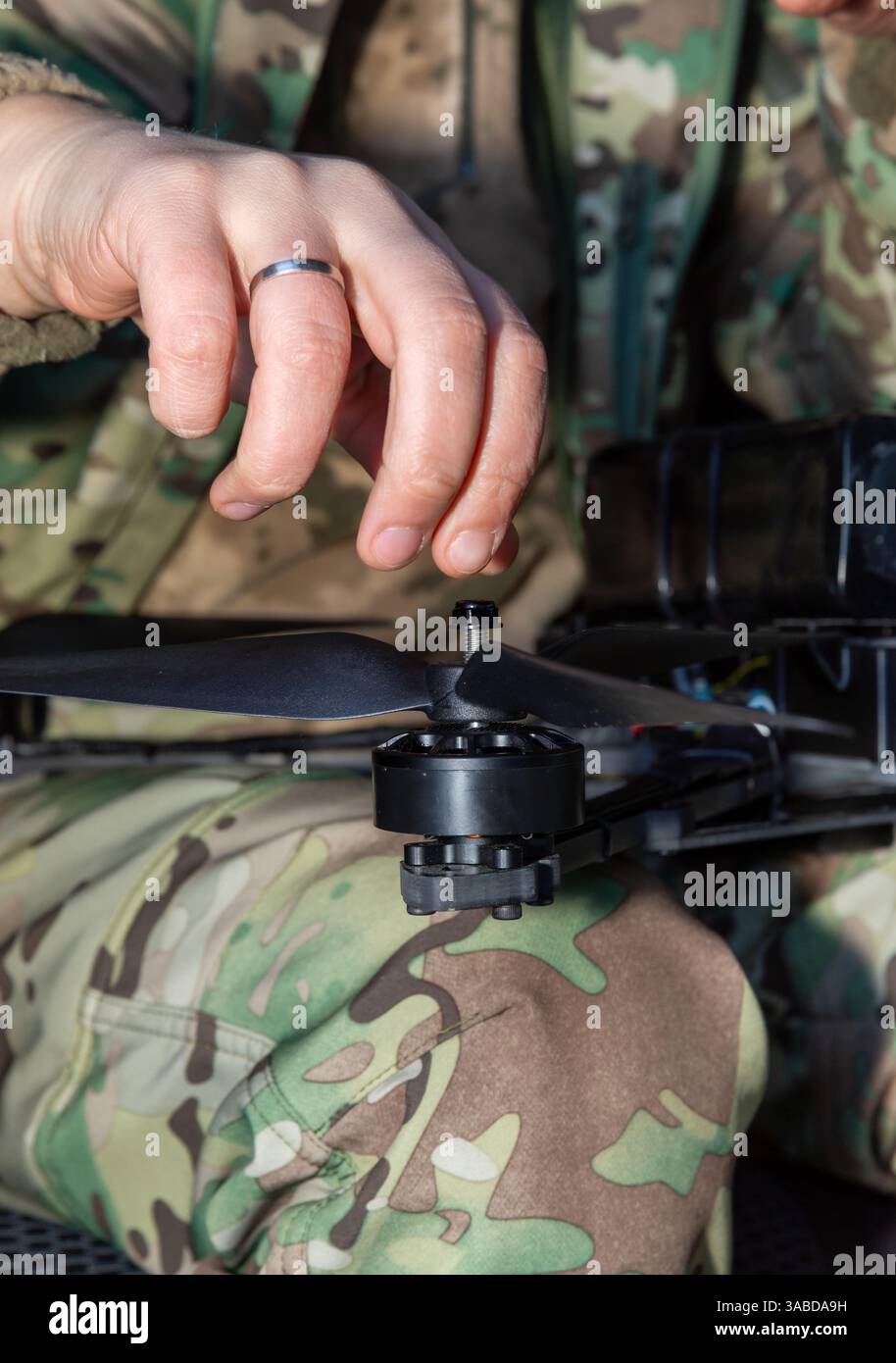 A female UAV operator is seen assembling the drone before the test ...