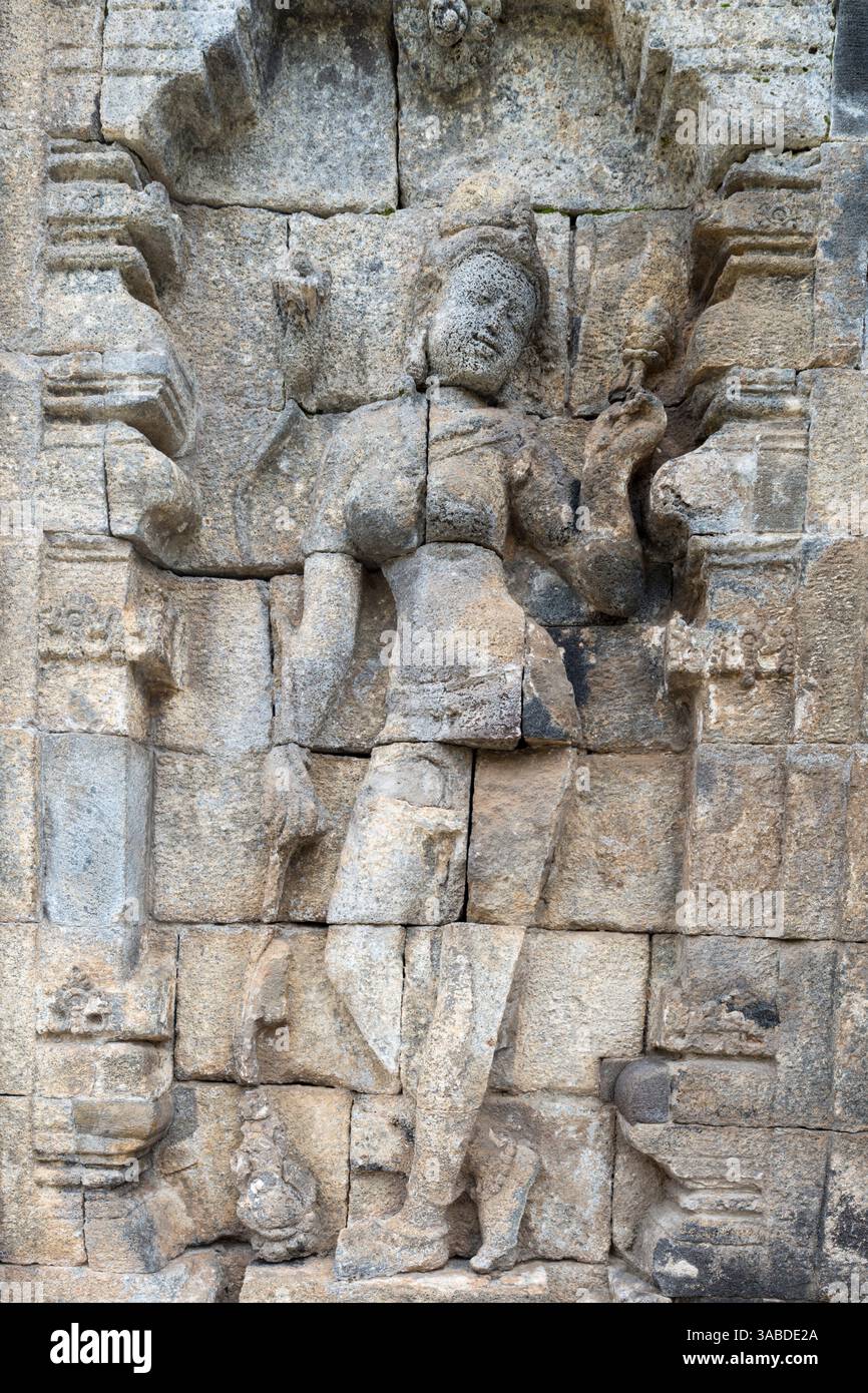 Bas relief on the outer wall of Pawon Temple, Magelang, Central Java ...