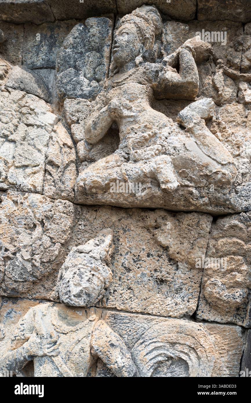 Bas relief on the outer wall of Pawon Temple, Magelang, Central Java ...