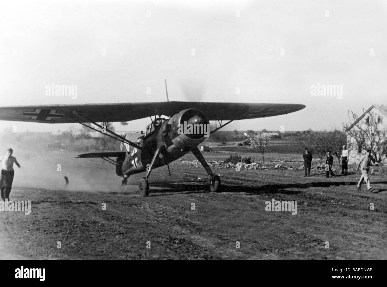 A Henschel Hs 126 takes off from a village road in the southern section ...