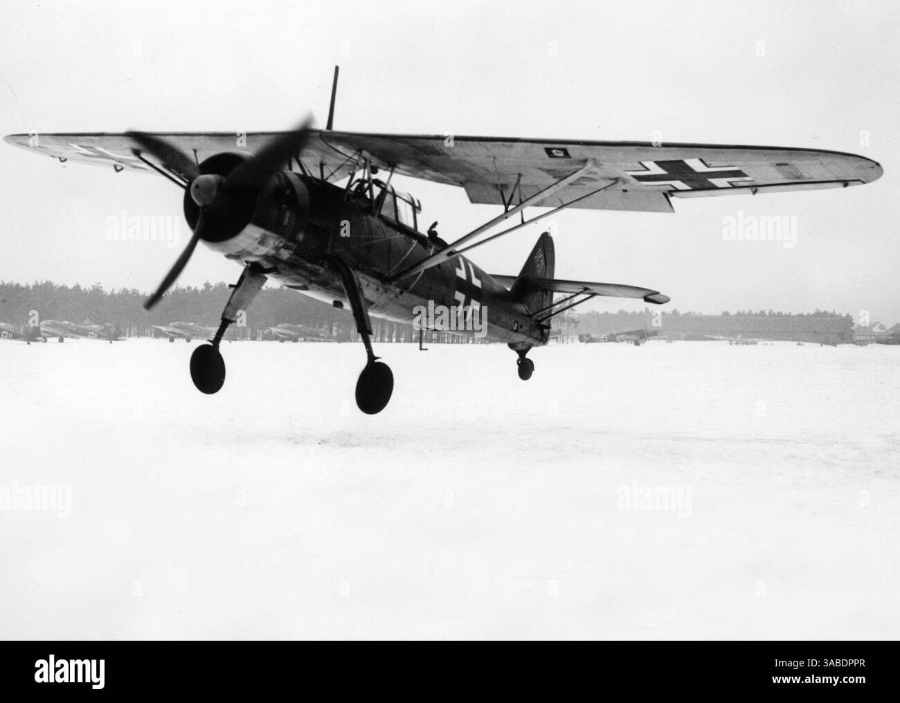 Henschel Hs 126 reconnaissance aircraft taking off from a snow-covered ...