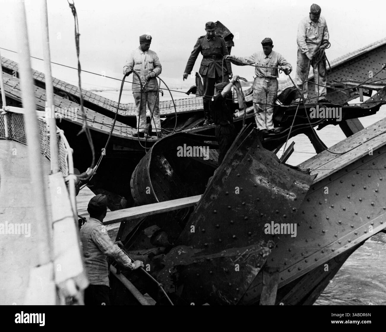 Members of the German technical emergency aid team repairing the bridge ...