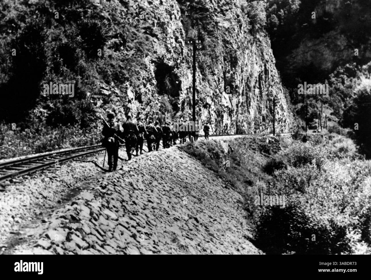 Waffen SS soldiers on a railroad line in Yugoslavia. They are supposed ...