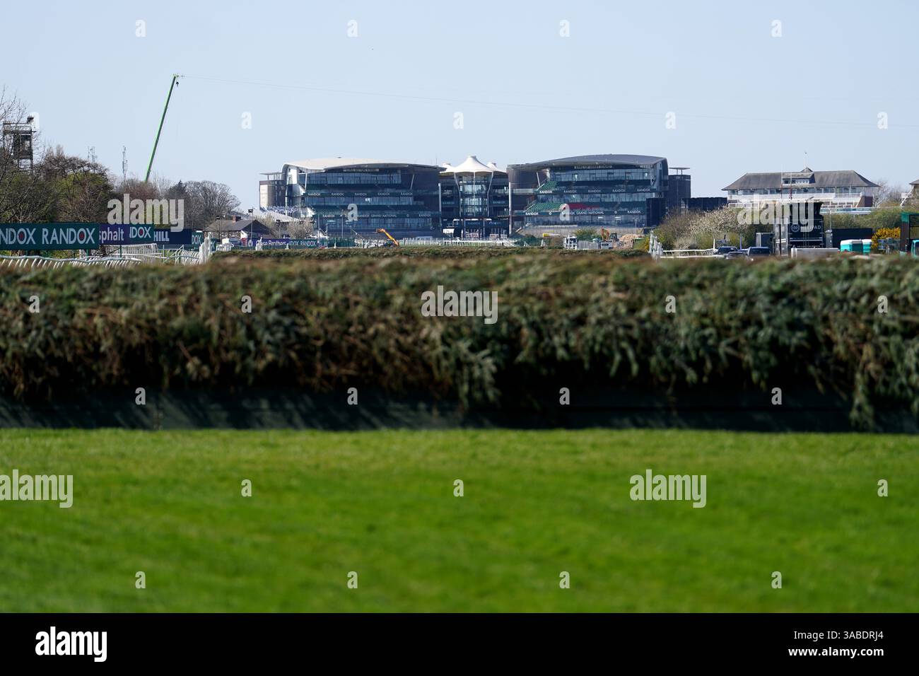 A view of the grandstand over Becher's Brook at Aintree Racecourse in ...