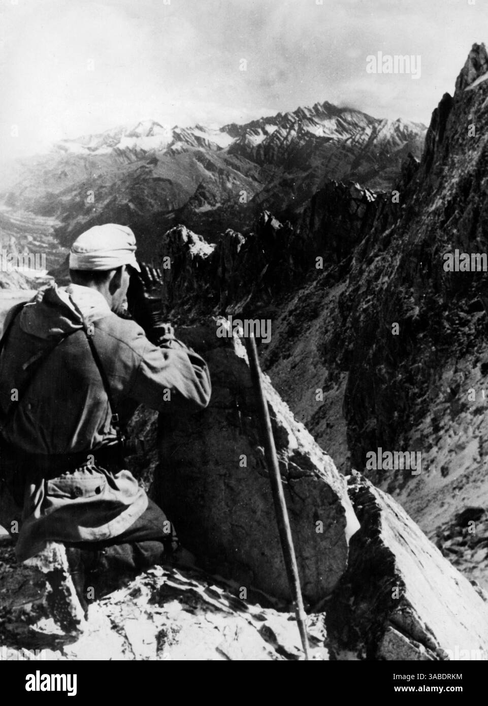 German mountain troops observe the terrain in the Balkan mountains ...