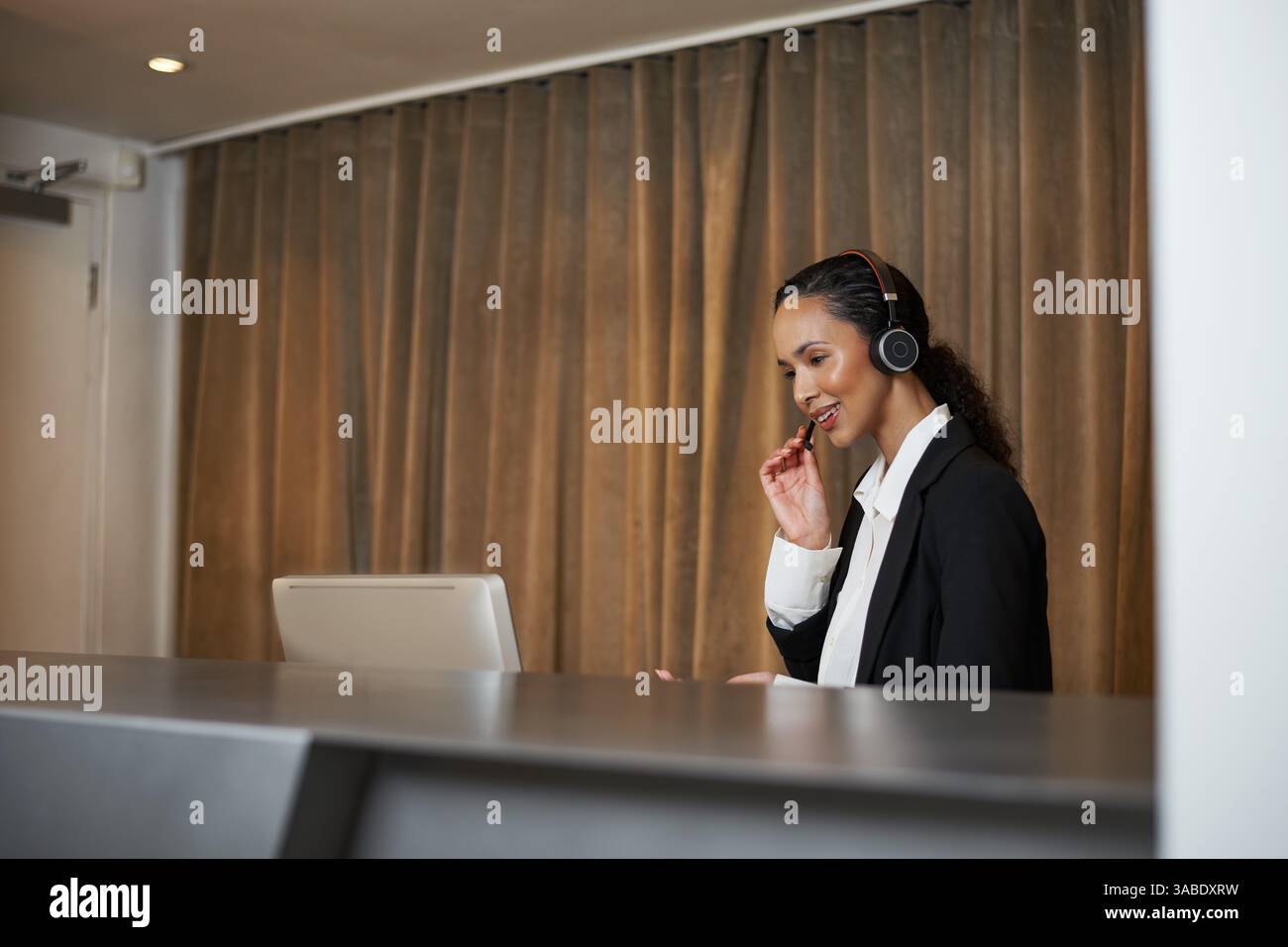 Professional Receptionist Providing Excellent Customer Service in a ...