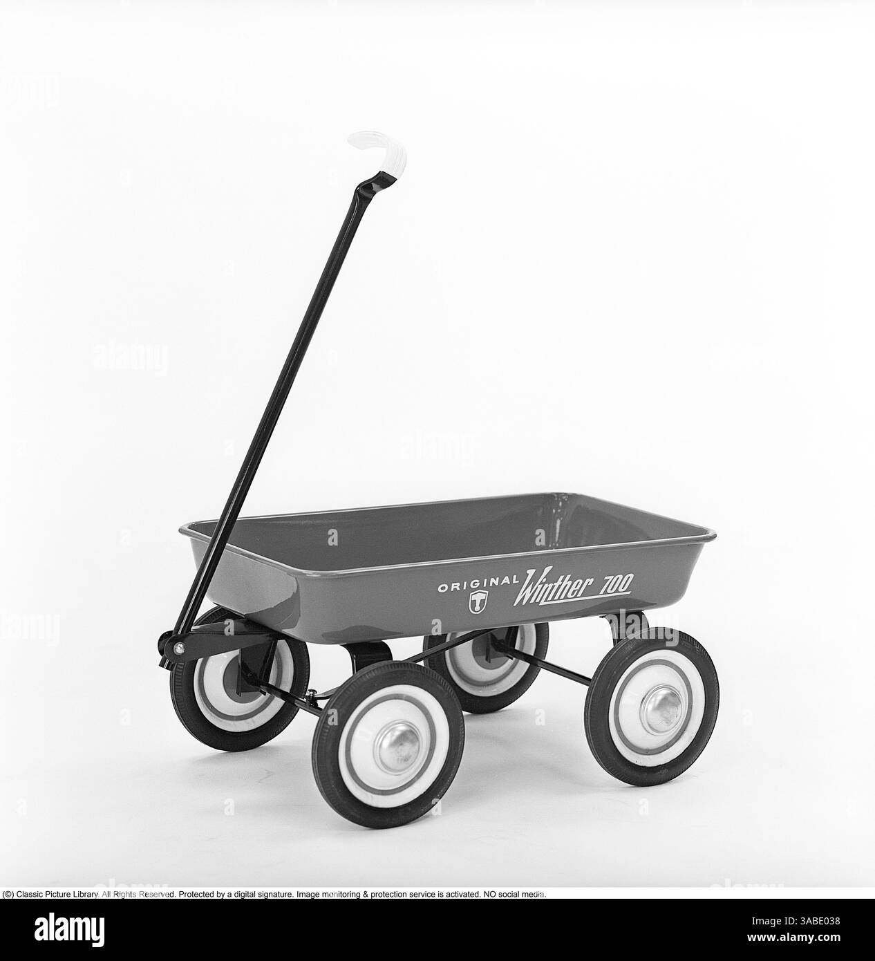 Small cart in the 1960s. A small cart with four wheels that in the ...