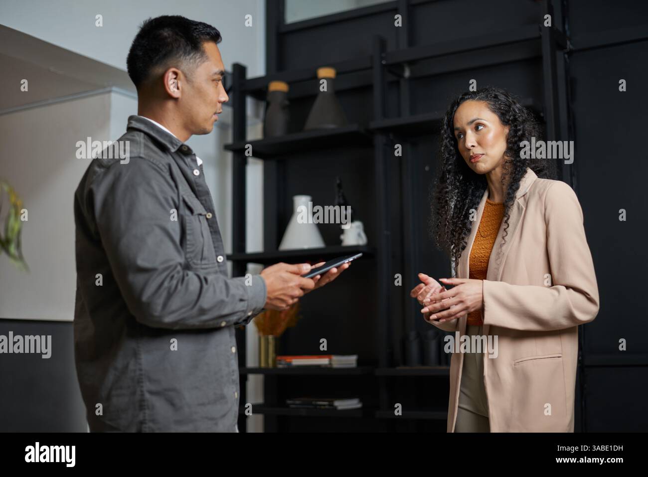 Business Discussion Between Two Colleagues in a Stylish Modern Office ...