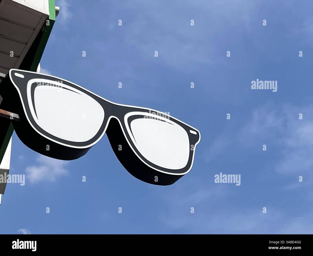 Glasses sign at the entrance to the optical store Stock Photo - Alamy