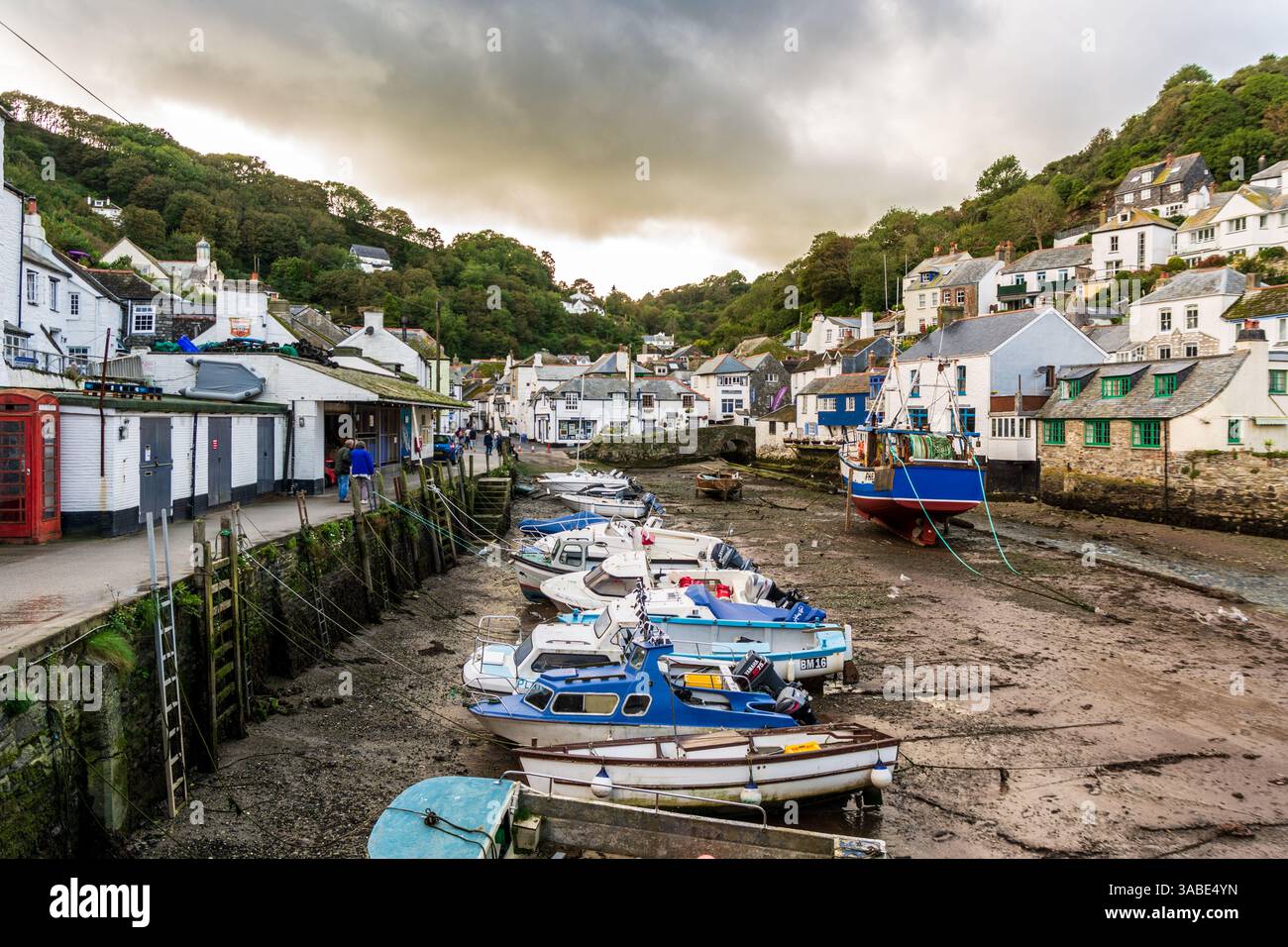 The charming village of Polperro, Cornwall, with its harbor at low tide ...