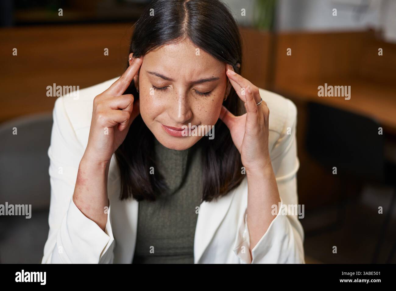 Thoughtful Woman in Professional Setting Facing Workplace Challenges ...