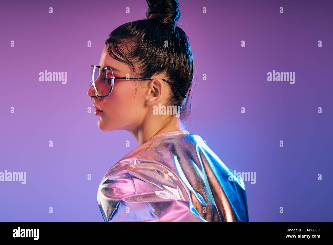 A fashionable woman showcases her modern style, featuring holographic ...