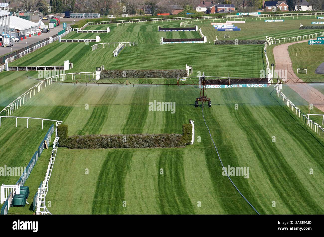 The grass is watered between The Chair and the Water Jump at Aintree ...