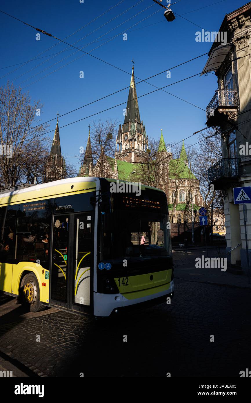 Lviv, Ukraine - April 01, 2025: A bright yellow passenger bus in front ...