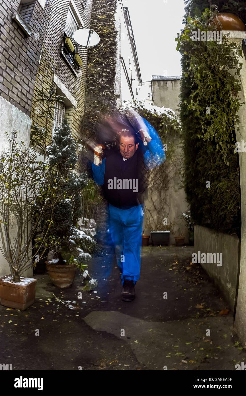 PARIS, France, Man in Backyard, Holding Sack of Coal, Delivery of Coal ...