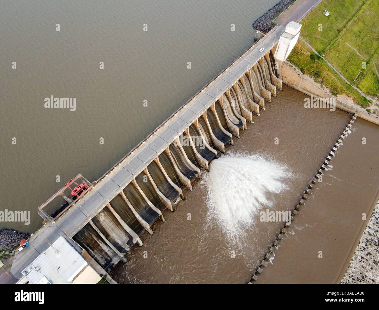 Impressive view of a modern dam with a waterfall creating a "bridal ...