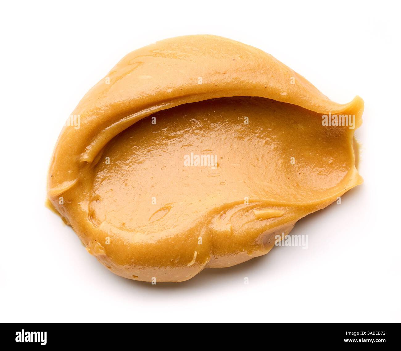 Smear of tasty caramel paste on white background, top view Stock Photo ...
