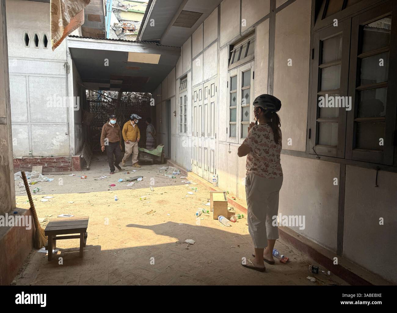 Mandalay, Myanmar. 01st Apr, 2025. Mother of Shin Shin prays in ...