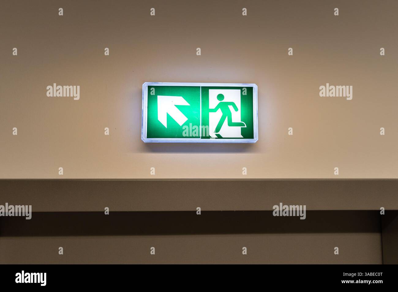 exit emergency sign above door hotel office space Stock Photo - Alamy