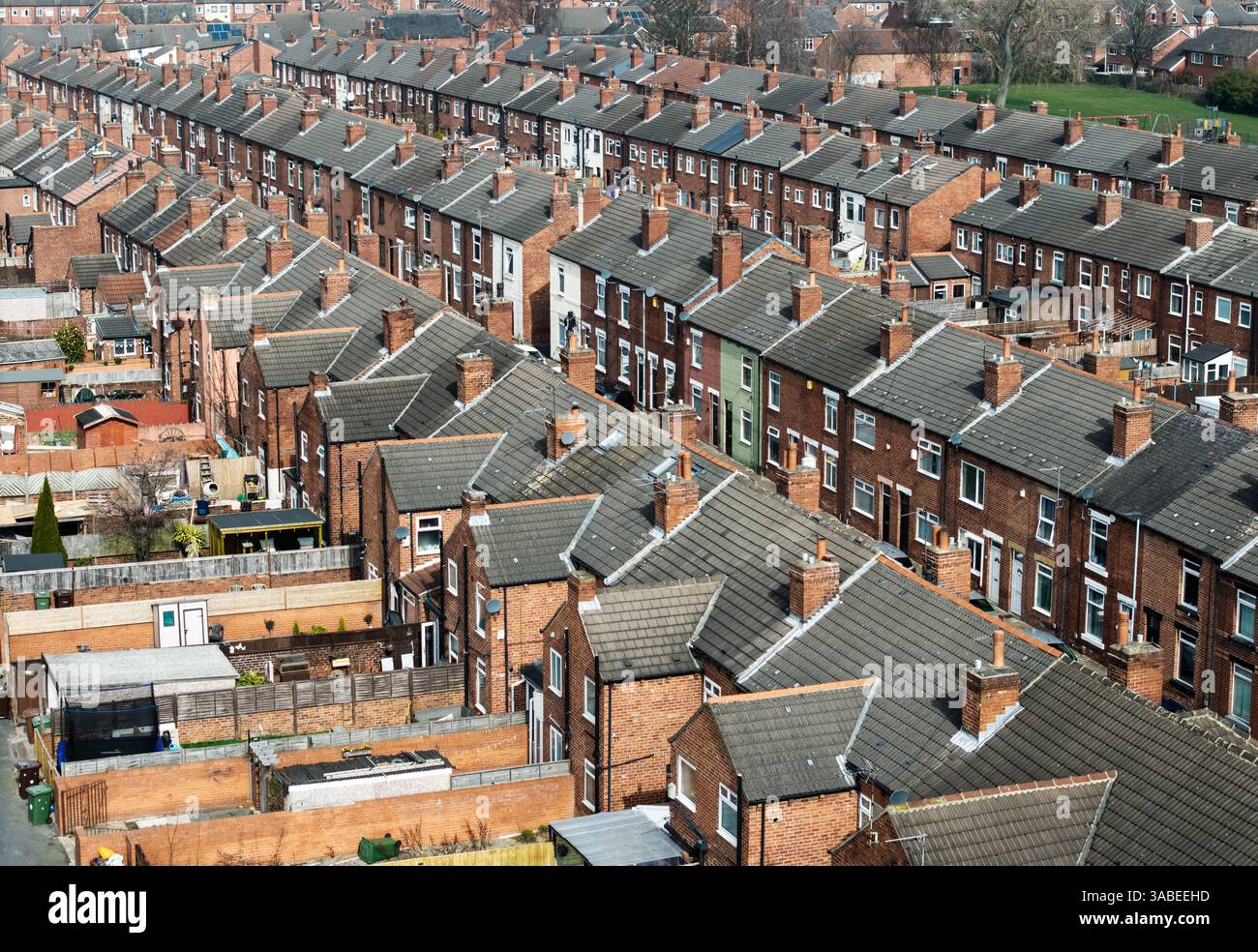 An aerial view above the rooftops of run down back to back terraced ...