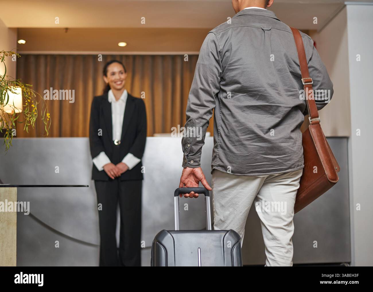 Business Professional Greeting Hotel Receptionist Upon Arrival at ...