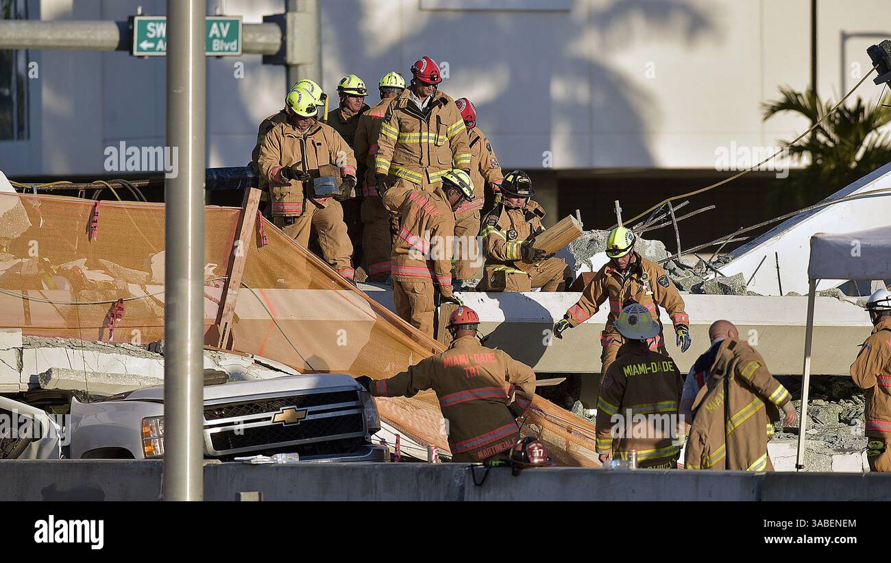 March 15, 2018 - Miami, FL, USA - Rescuers search through the rubble of ...