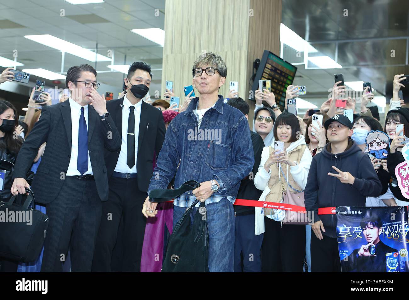 TAIPEI, CHINA - APRIL 2, 2025 - Japanese actor Takuya Kimura arrives at ...